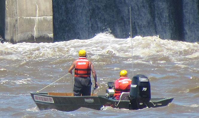 Boat, two men go through Keokuk dam - Keokuk Volunteer Emergency Corps
